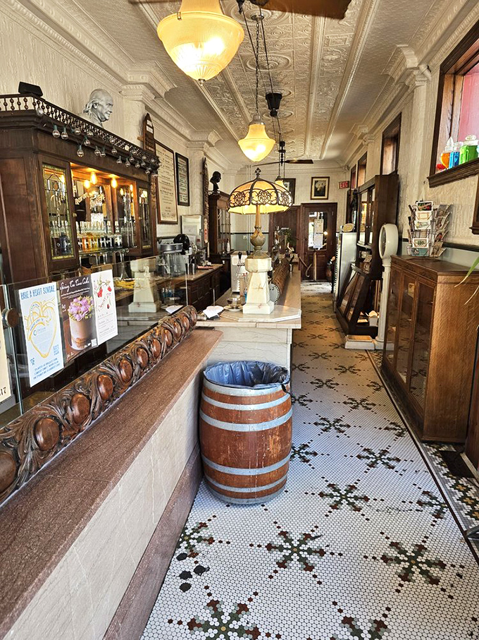 The mosaic floor tells you this place takes tradition seriously. That wooden barrel isn't decorative&mdash;it's a statement about doing things the old way.