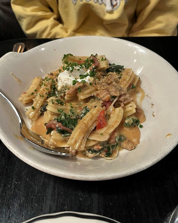 Pasta that doesn't just sit on the plate &ndash; it tells a story of fresh herbs, savory sausage, and a sauce worth sopping up with every available bread surface.