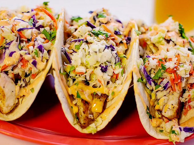 These fish tacos aren't just a meal; they're a colorful fiesta wrapped in tortillas. The slaw adds crunch while the fish remains the undisputed star.