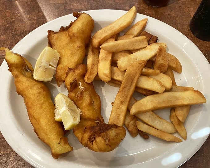 Fish and chips that crackle with each bite, served with fries so perfectly golden they deserve their own Instagram account.