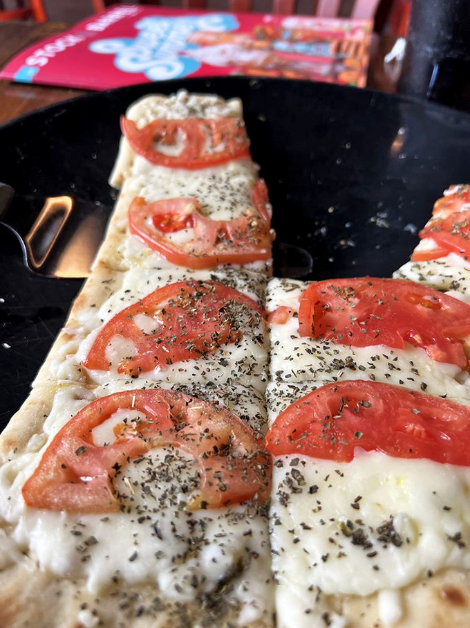 Pizza that doesn't need to shout to get your attention &ndash; just fresh tomatoes, melty cheese, and herbs on a perfectly crisp crust.