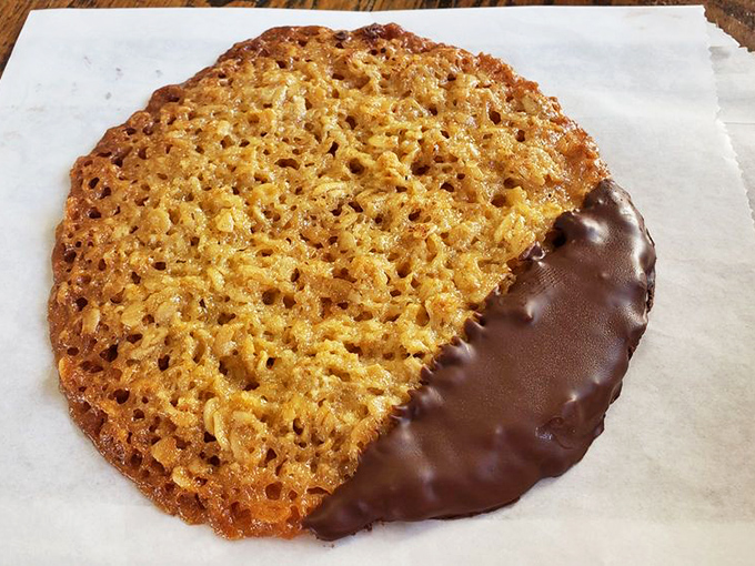 Half-dipped in chocolate, this Florentine cookie is the sophisticated cousin in the pastry family &ndash; crisp, caramelized, and impossible to eat just one.
