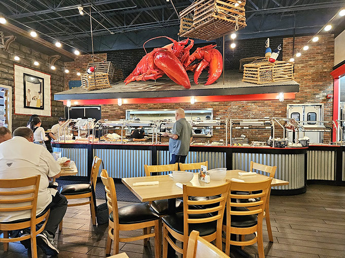 The buffet line stretches beneath that watchful lobster mascot, a red sentinel guarding treasures from the deep.