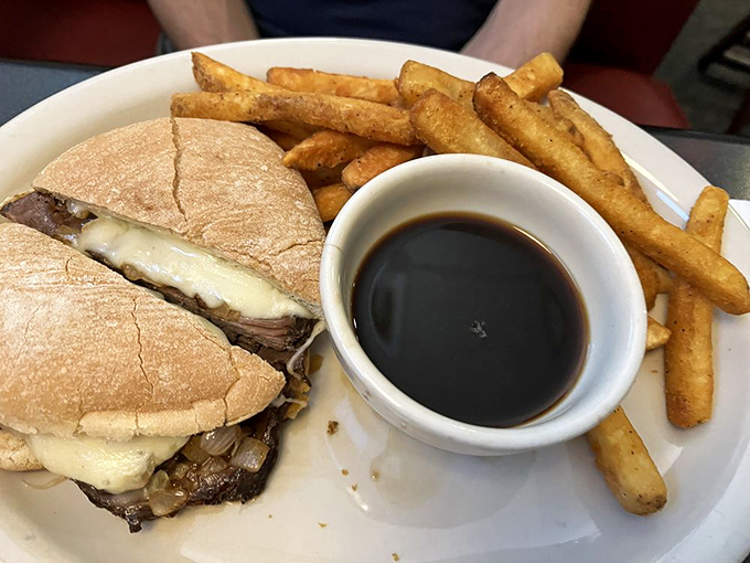 The French Dip&mdash;where thinly sliced beef meets melted cheese on pillowy bread with a side of au jus for necessary dipping adventures. 