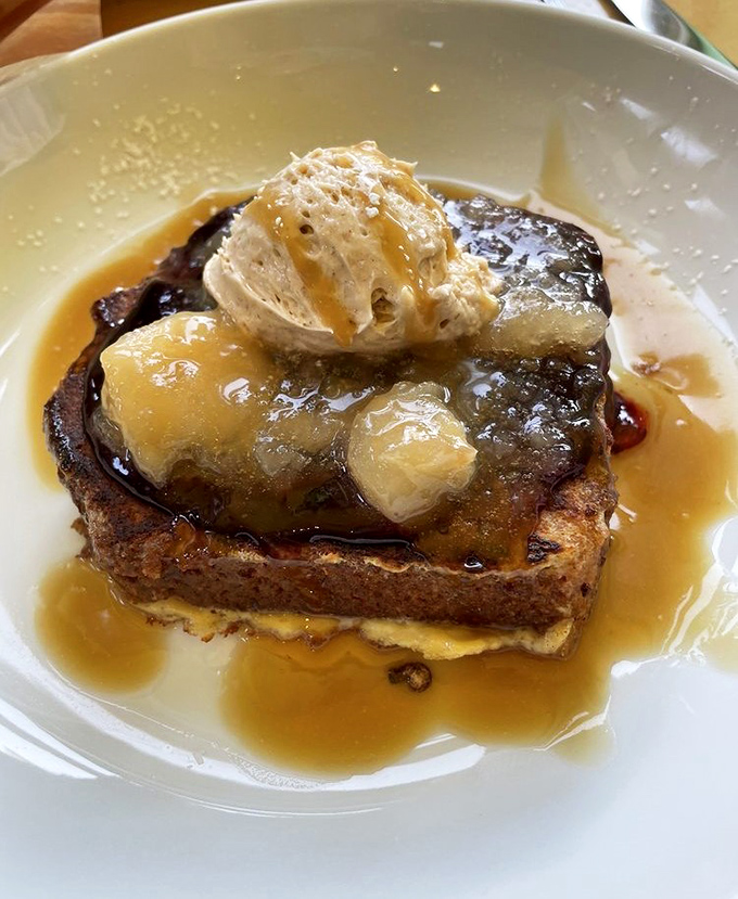 French toast that's transcended its humble origins&mdash;caramelized, topped with fruit, and swimming in syrup like it's taking a delicious spa day.