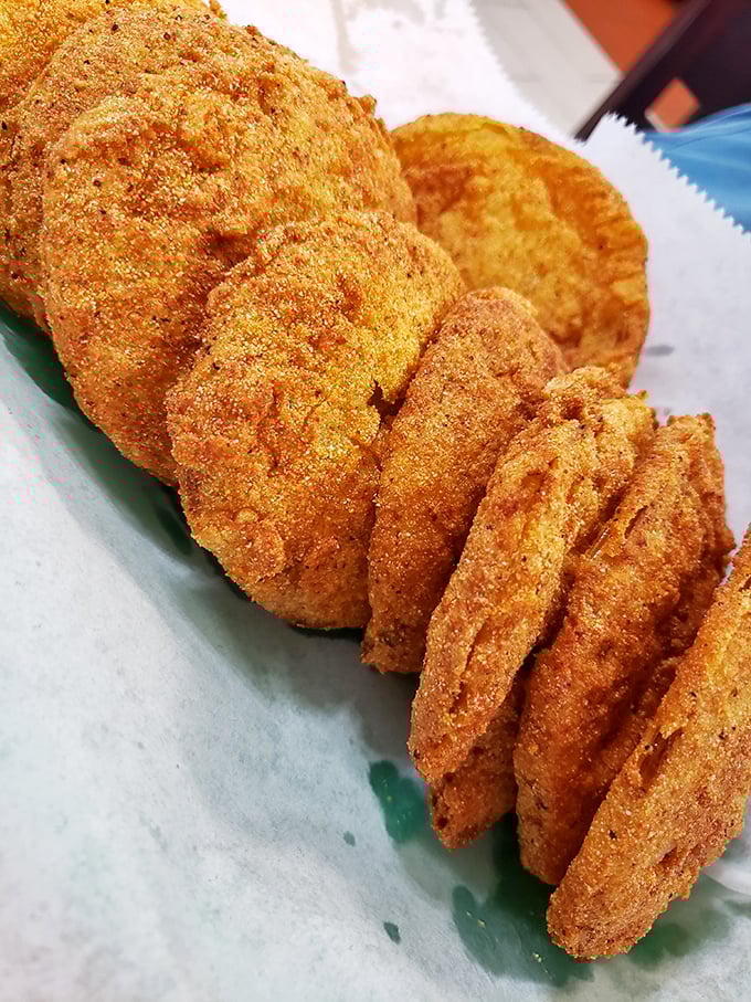 Golden discs of Southern ingenuity&mdash;fried green tomatoes that balance tartness and crunch in perfect harmony.