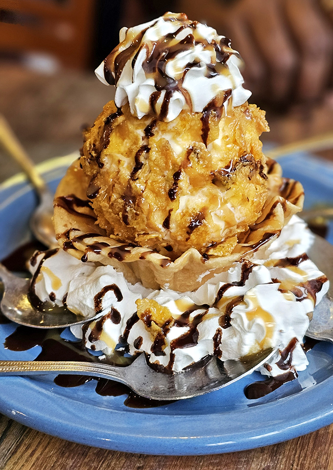 Fried ice cream that defies physics&mdash;hot, cold, crunchy, and creamy in each bite. This mountain of dessert perfection makes sharing both necessary and slightly disappointing.