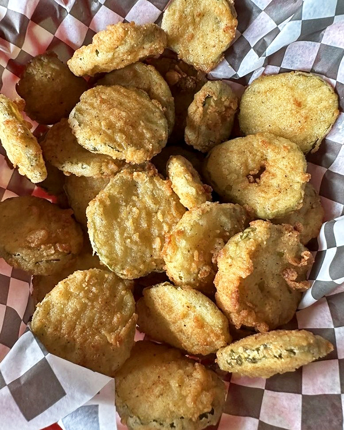 Fried pickles that achieve the impossible: maintaining their crunch while delivering that perfect vinegary tang. The unsung heroes of the appetizer world.