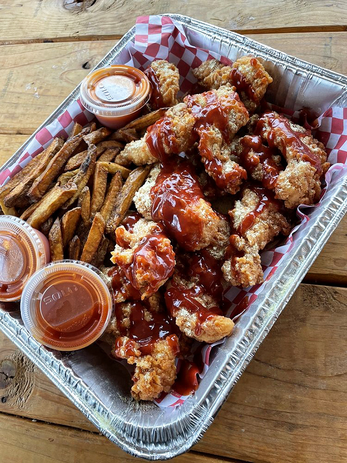 This aluminum tray might look humble, but it's actually a treasure chest of crispy, juicy gold that puts fast food to shame.