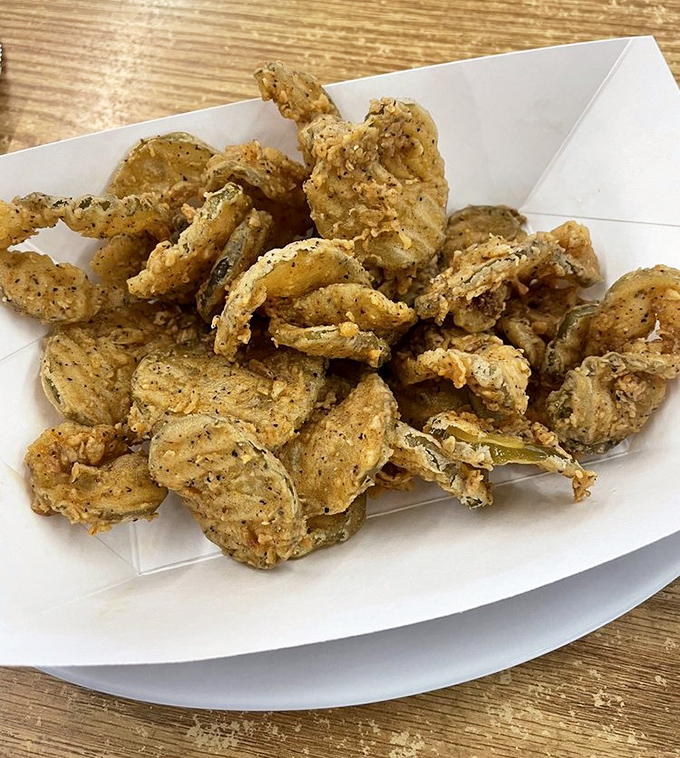 Fried pickles that crunch like autumn leaves, except these leaves make you say "wow" instead of "I should really rake these."