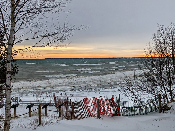 Winter transforms Whitefish Dunes into a snow globe scene—minus the shaking, unless you count shivering in your boots.