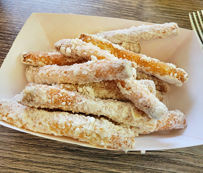Funnel cake fries dusted with powdered sugar&mdash;proof that state fair magic can be enjoyed year-round without having to pay for parking or ride tickets.