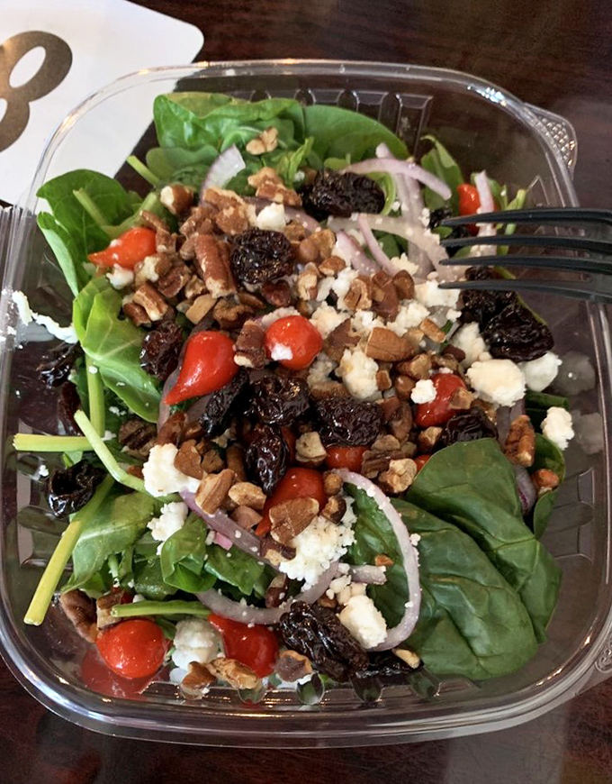 A garden salad that doesn't apologize for being healthy – bright, fresh ingredients proving vegetables can party just as hard as their sandwich counterparts.