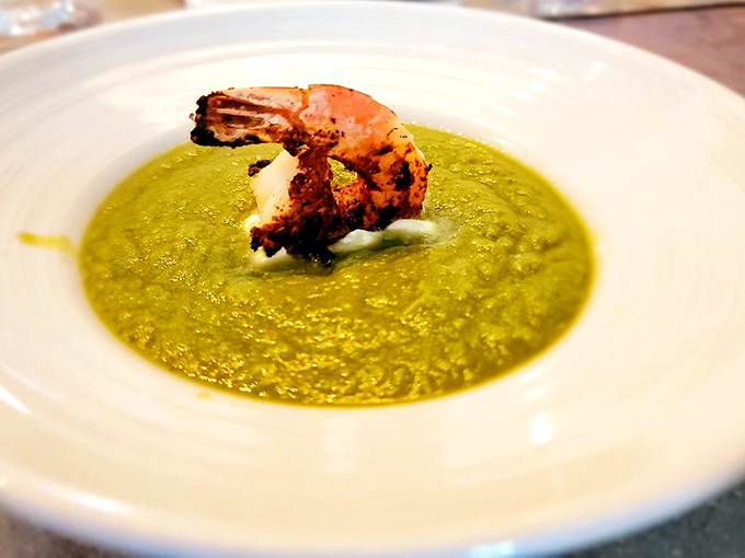 A vibrant green gazpacho crowned with a perfectly cooked shrimp. This soup doesn't just refresh &ndash; it transports you to coastal Spain. 