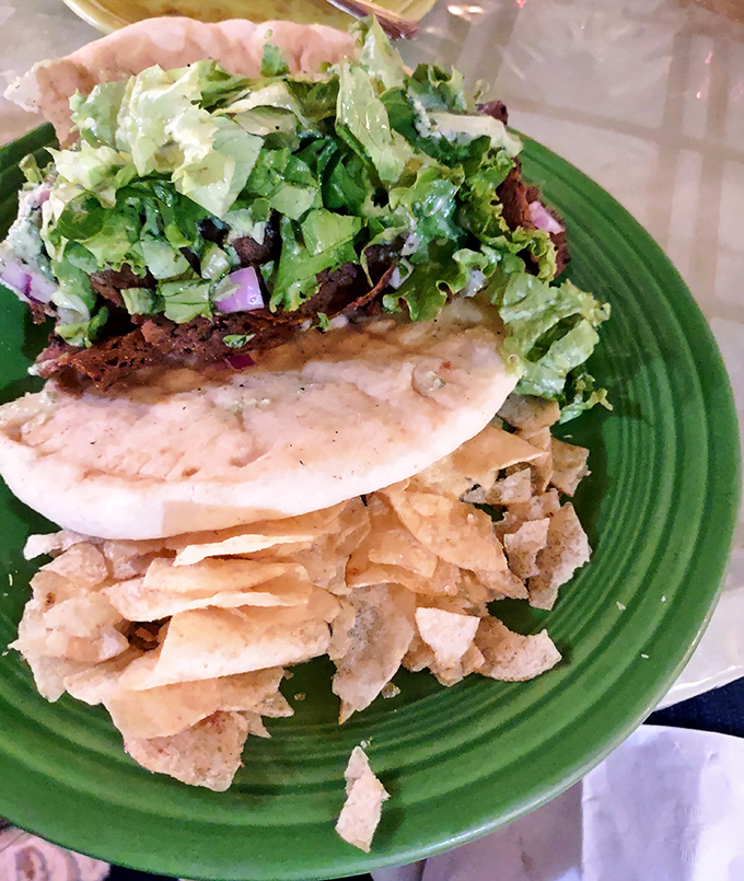 This isn't just a sandwich&mdash;it's architecture. Layers of plant-based goodness stacked high enough to require a game plan before the first bite.