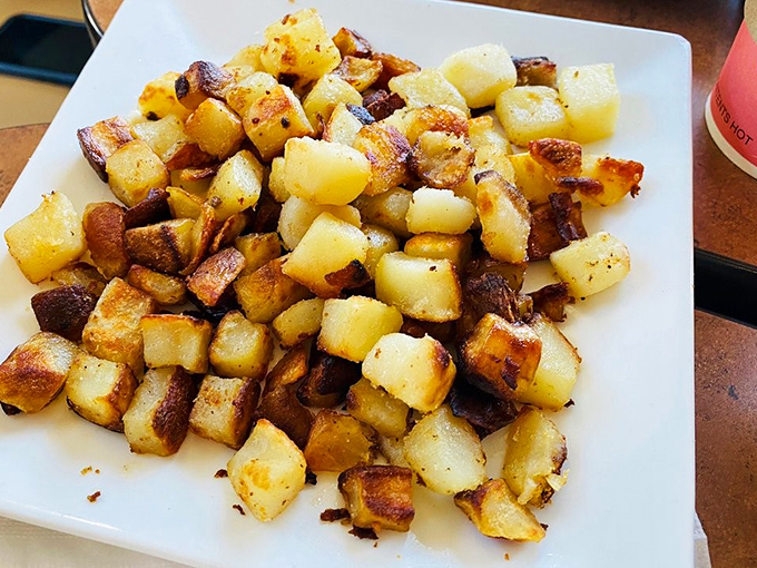 Home fries with personality&mdash;crispy edges, tender centers, and seasoned with what appears to be a PhD in potato perfection. The supporting actor that steals the show.
