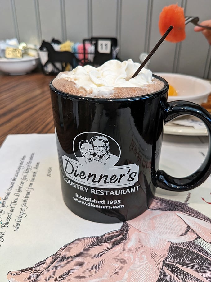 Hot chocolate that doesn't just warm your hands but your entire outlook on life. That whipped cream mountain with its candy cane ski slope is pure joy.