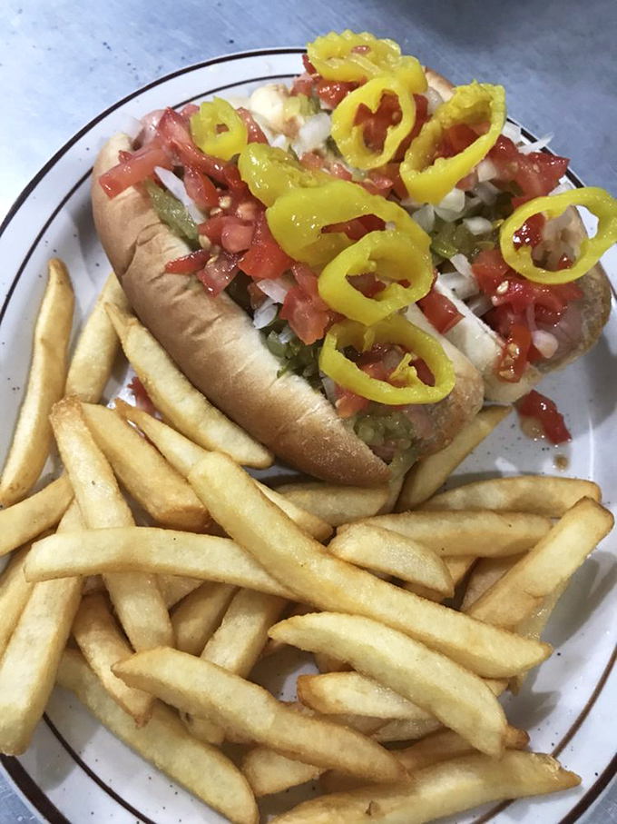Hot dog architecture at its finest&mdash;the toppings-to-bun ratio is mathematical perfection. Those banana peppers add just the right zing.