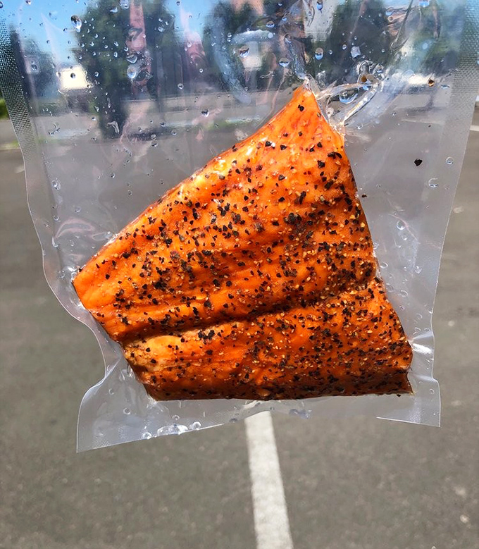 That vacuum-sealed packet contains what might be the world's most perfect road trip snack &ndash; pepper-crusted smoked salmon that makes gas station beef jerky weep with inadequacy.