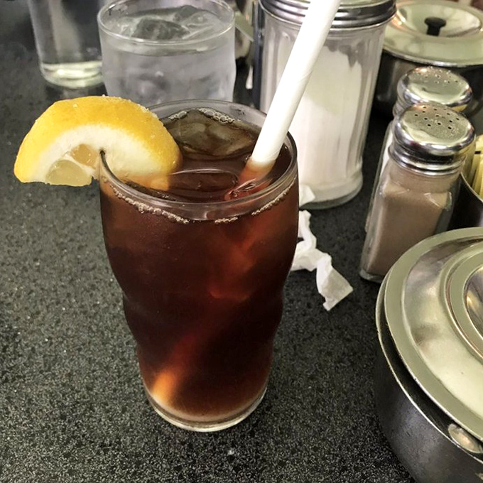 The iced tea comes with a lemon wedge perched on the rim like it's saying, "Trust me, I'm exactly what your parched throat ordered."