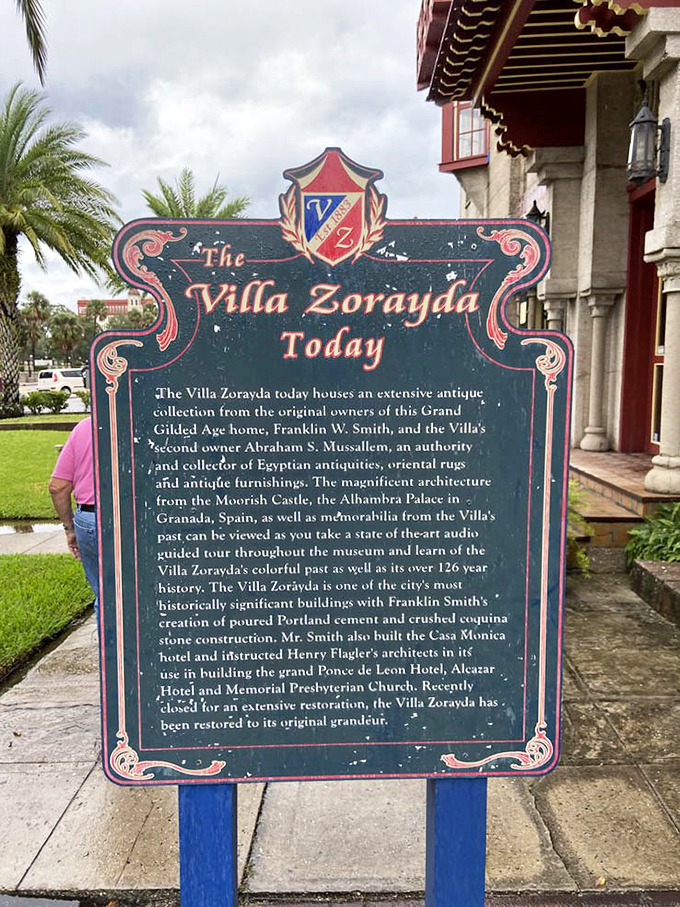 History unfolds on this weathered sign, telling tales of concrete innovation and architectural influence that spread throughout St. Augustine like ripples from a stone.