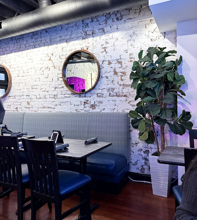 Cozy booth seating that invites you to settle in and forget about your diet plans. That fiddle-leaf fig isn't judging your food choices&mdash;it's celebrating them.