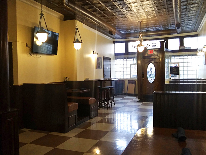 The bar area beckons with its polished wood and classic ambiance. A place where "I'll just have one drink" becomes a three-hour conversation.