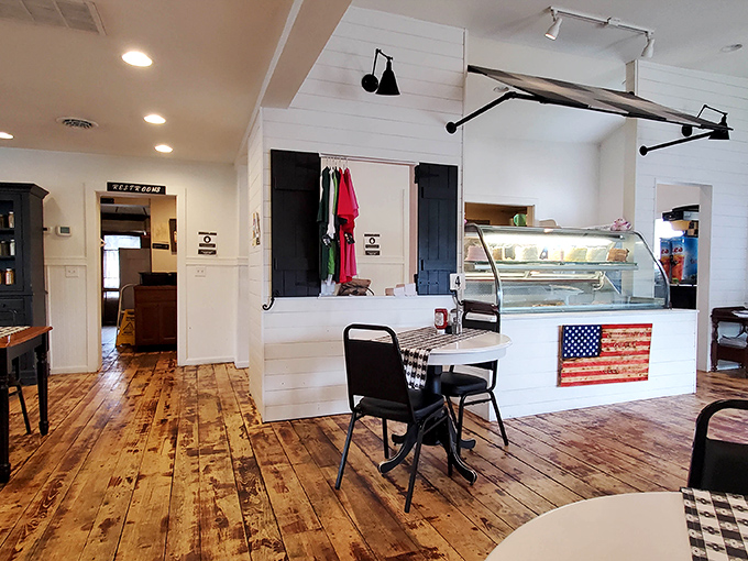 White shiplap walls and warm wood floors create that "farmhouse chic" atmosphere that HGTV tries to replicate but can't quite capture the authenticity.