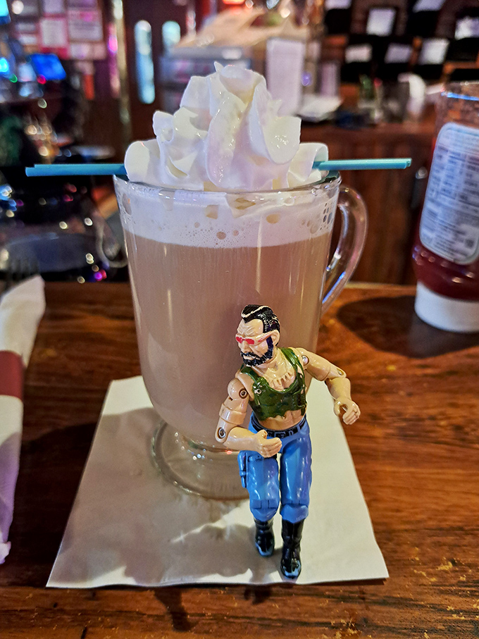 Not just Irish coffee, but a tiny action figure standing guard&mdash;because even your morning caffeine deserves its own superhero.