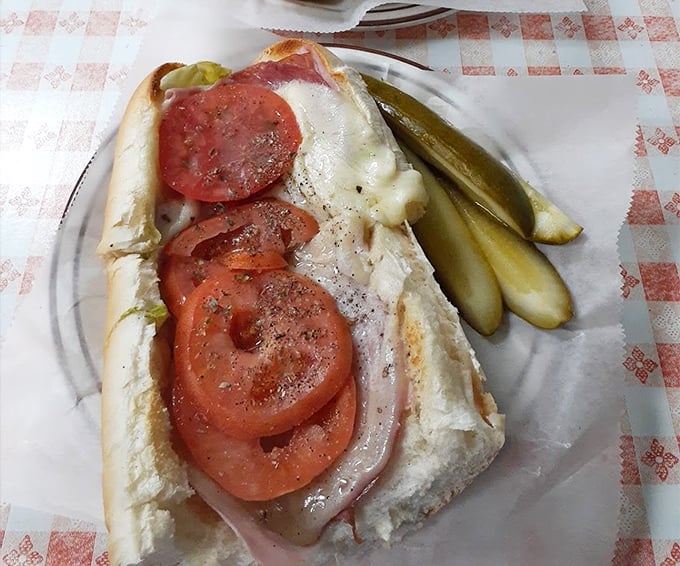 The Italian grinder &ndash; where every bite delivers a Mediterranean vacation without the airfare. Those tomatoes look like they actually remember what sunshine feels like.