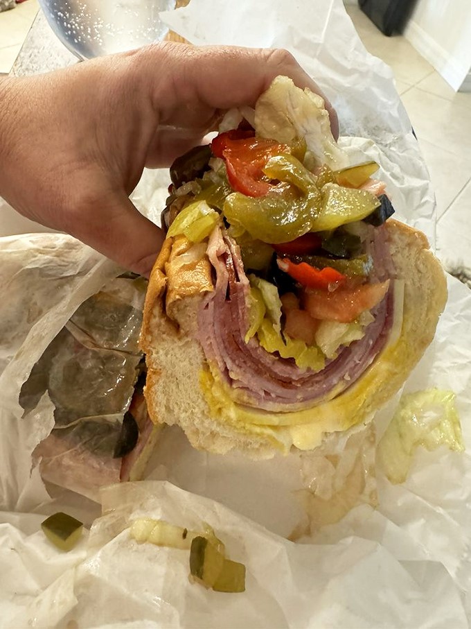 Layer upon layer of Italian meats and veggies create a skyscraper of flavor. The structural engineering alone deserves an award.