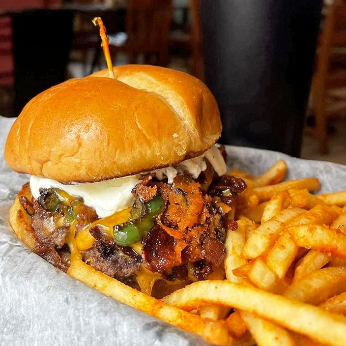 This burger doesn't just have toppings&mdash;it has ambitions. Melted cheese cascading over bacon and peppers like a delicious waterfall.