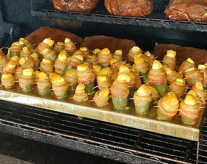 Bacon-wrapped jalapeño poppers lined up like delicious little soldiers, ready to march straight into flavor country with corn kernels standing at attention.