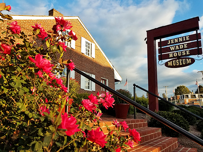 The Jennie Wade House Museum, surrounded by blooming flowers, tells stories of courage amid beautiful garden settings.