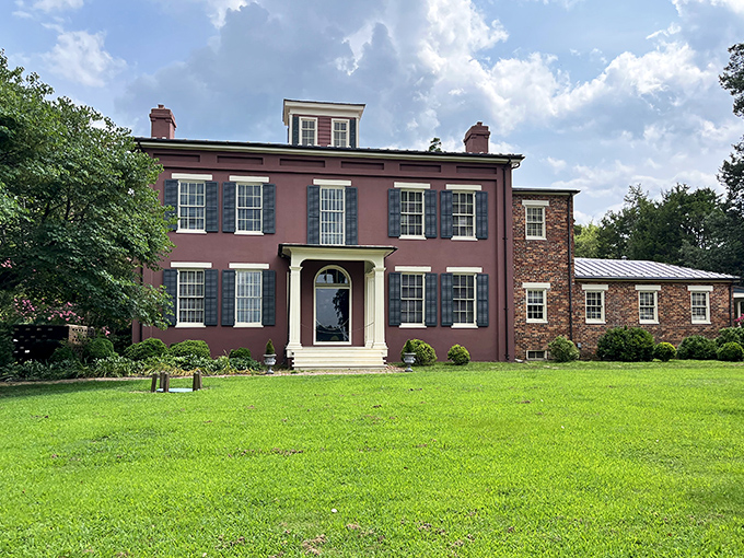 The Jones-Stewart Mansion stands proudly in its rose-colored brick glory. If these walls could talk, they'd need their own Netflix documentary series.