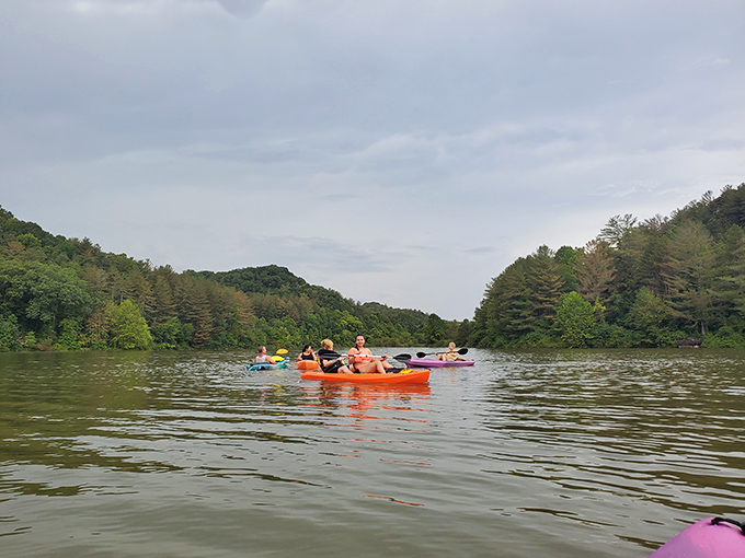 Kayakers explore Dow Lake's peaceful waters, discovering coves and inlets that can't be reached by car, foot, or even the most determined pizza delivery person.