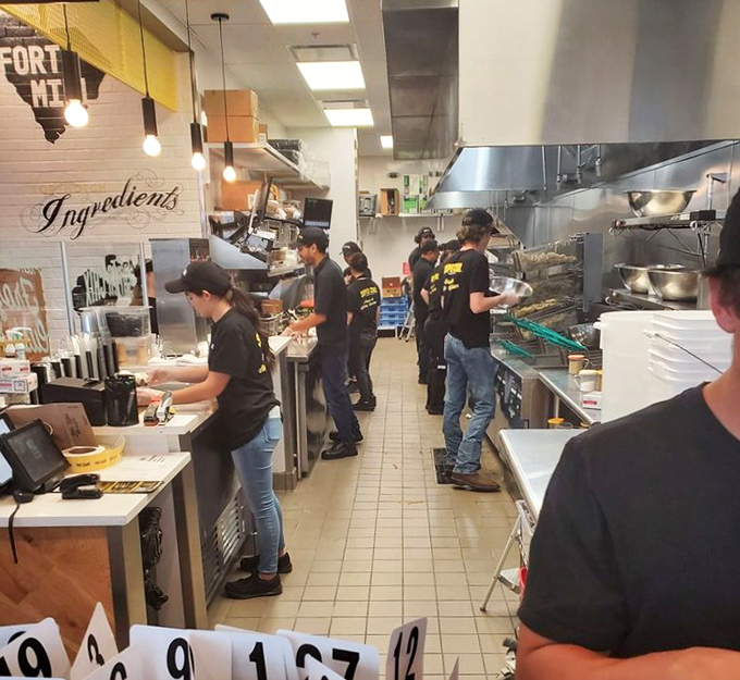 Behind the scenes magic where chicken dreams come true. This kitchen crew moves with the choreographed precision of a culinary ballet.
