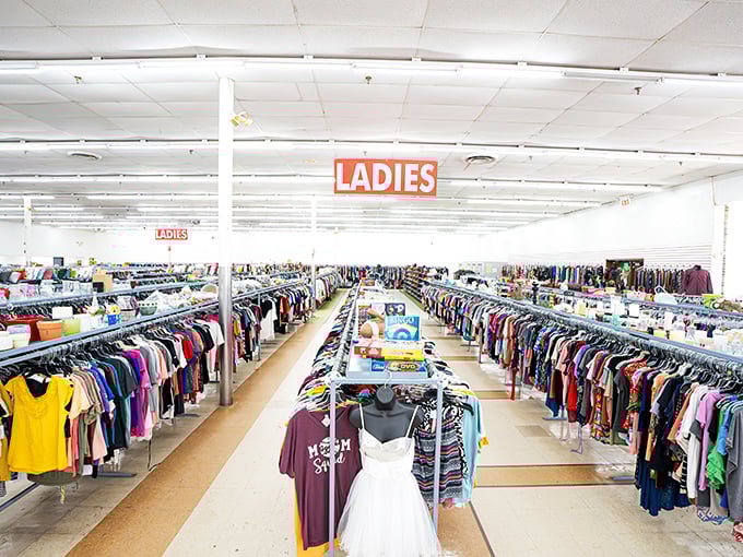The ladies' section stretches toward the horizon like a technicolor dream. From casual tees to wedding dresses, life's every occasion hangs in wait.