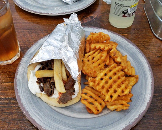 Another angle of gyro greatness&mdash;this time with those addictive waffle fries. A meal that satisfies both the inner child and the sophisticated adult palate.