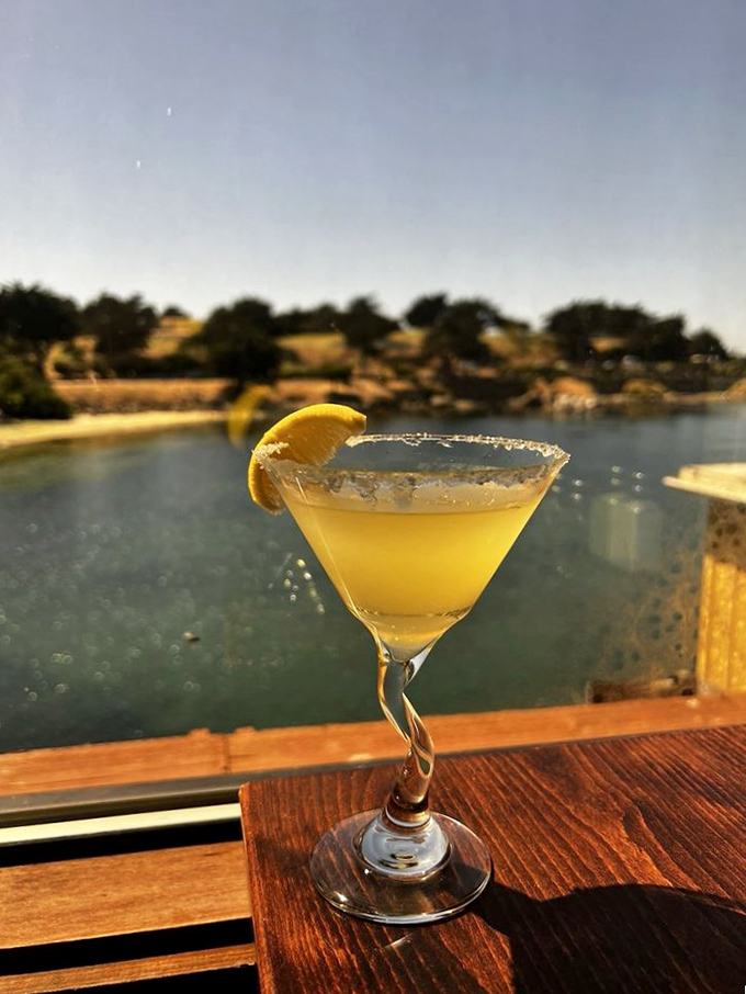 A lemon drop cocktail with the Monterey Bay as backdrop &ndash; proof that sometimes the best garnish for a perfect drink is a million-dollar view.