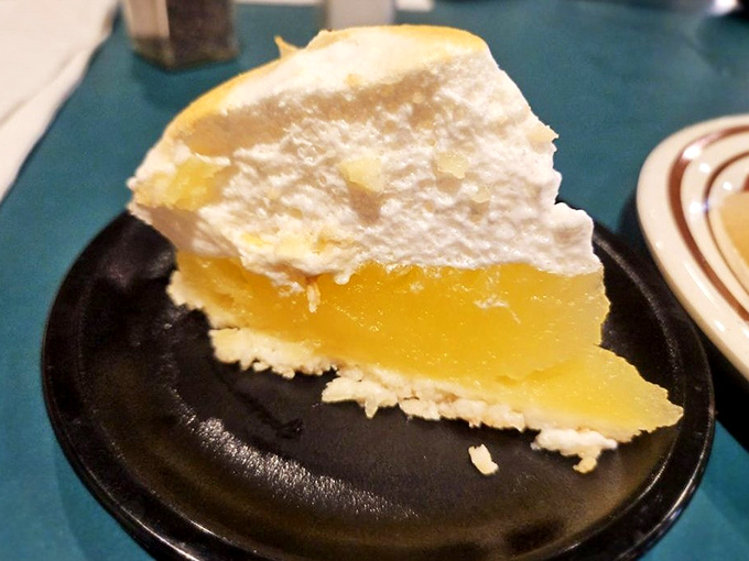 Lemon meringue pie with a cloud of whipped topping so light it might float away if not anchored by that tangy yellow filling.