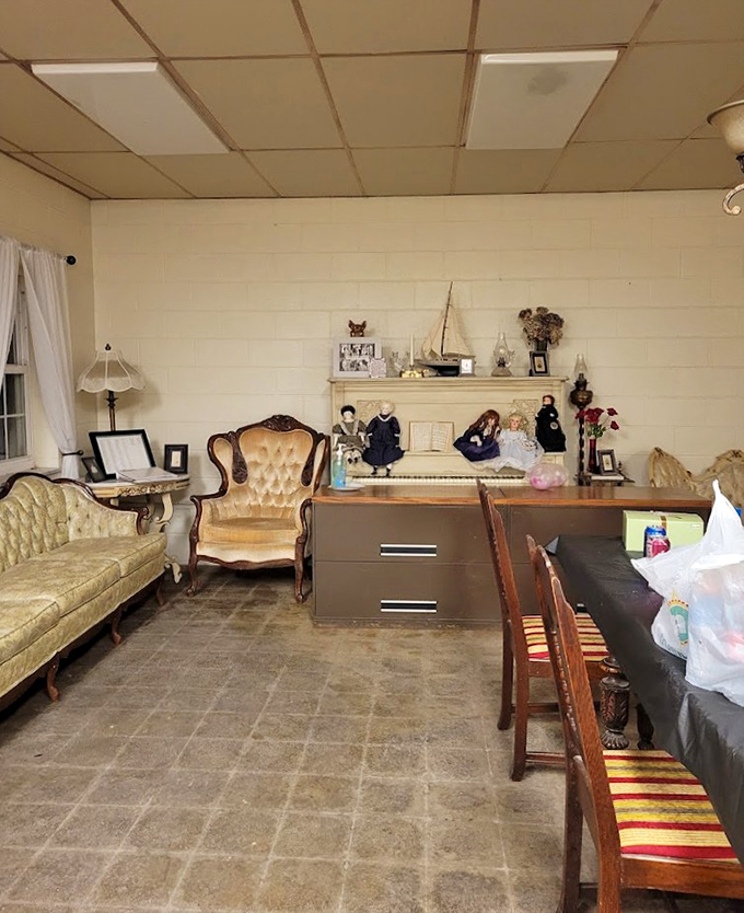 Period furniture creates a living museum effect. The vintage sofa has probably heard more confessions than a lifetime of priests.