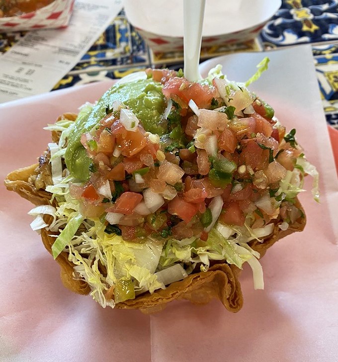 This taco salad isn't messing around—a crunchy tortilla fortress protecting a treasure of fresh toppings that laugh in the face of sad desk lunches everywhere.