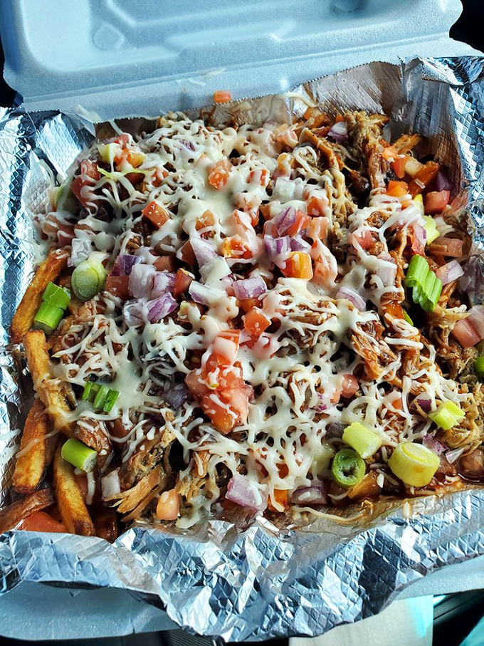 Loaded fries that require a game plan before eating. The cheese-to-topping ratio here is what mathematicians call "the golden delicious ratio."