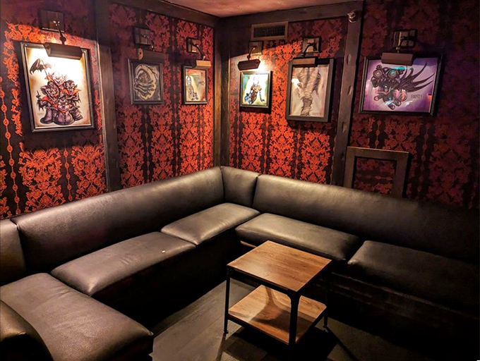 The lounge area offers intimate seating where conversations flow as smoothly as the cocktails.