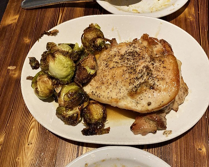 A perfectly cooked pork chop with Brussels sprouts that even vegetable skeptics would fight over. Simple food executed with extraordinary care.