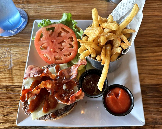 A burger so photogenic it deserves its own Instagram account&mdash;thick-cut tomato, crisp lettuce, and a patty that's clearly never met a freezer in its life.