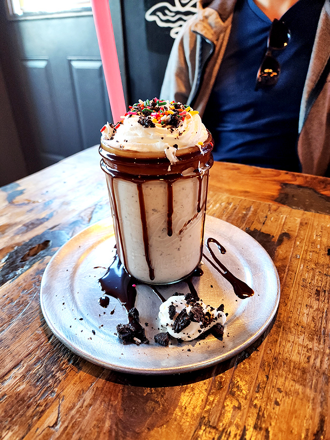 A milkshake that understands the assignment. Whipped cream, chocolate drizzle, and sprinkles&mdash;childhood nostalgia with adult indulgence.