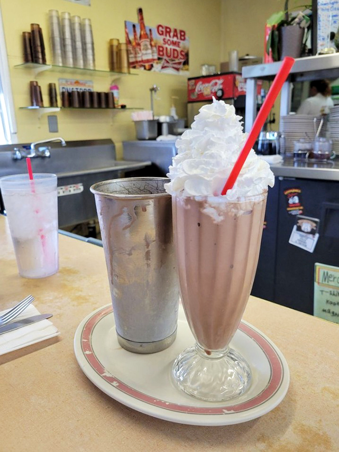 Milkshakes served in glasses that remember when Elvis was king. That whipped cream mountain on top isn't just decoration&mdash;it's a dairy Everest.
