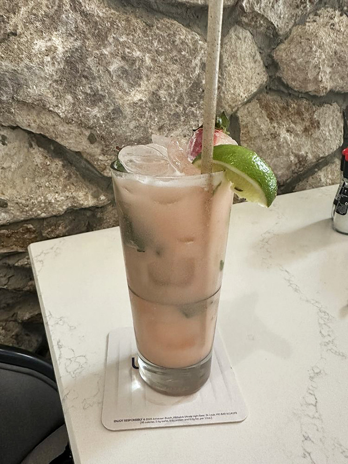 A mojito with a view! Fresh lime and mint mingle in this refreshing cocktail, perfectly positioned against Norwood's stone backdrop.